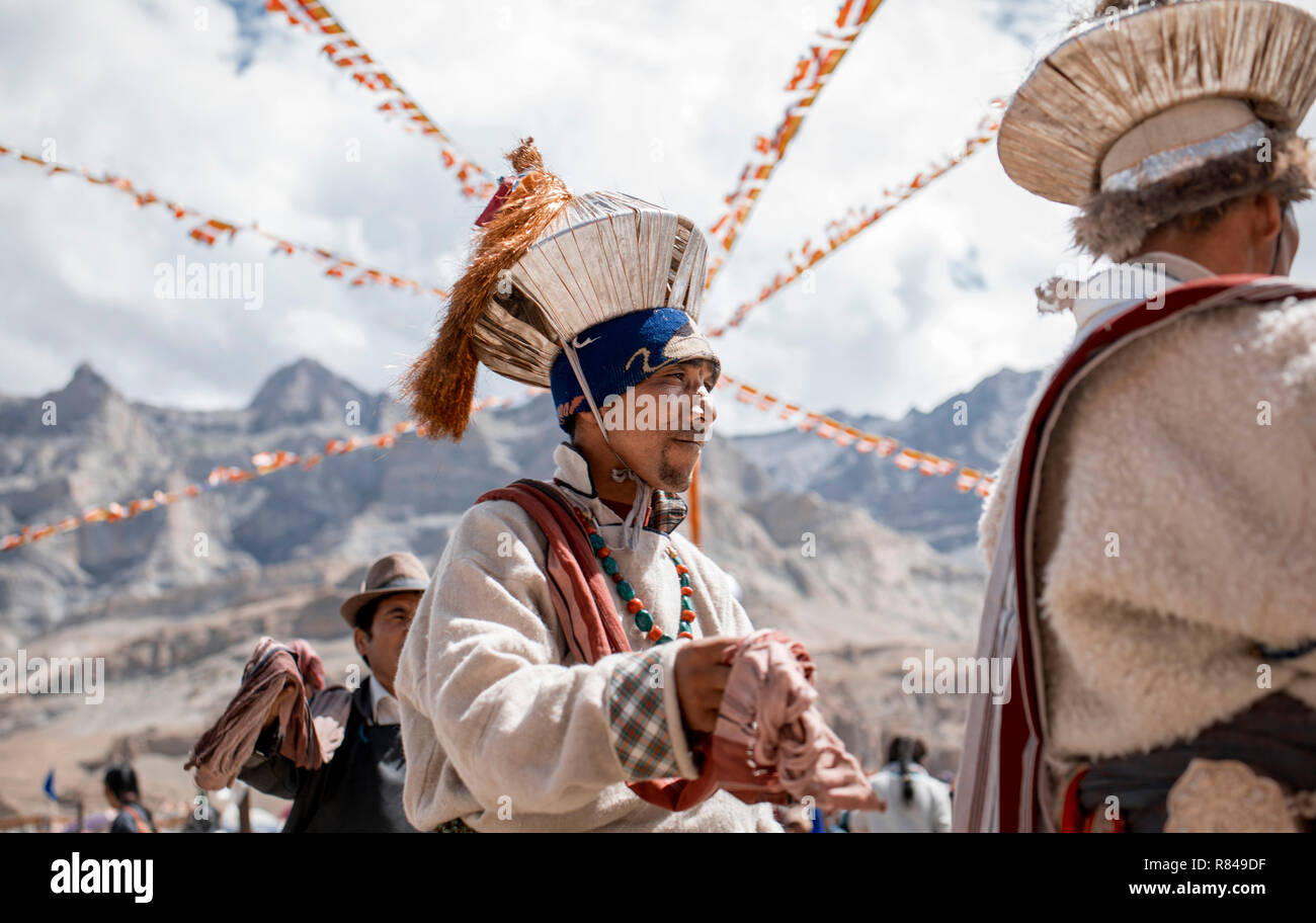 Ladakhi men dancing in a traditional dress during His Holiness Dalai ...