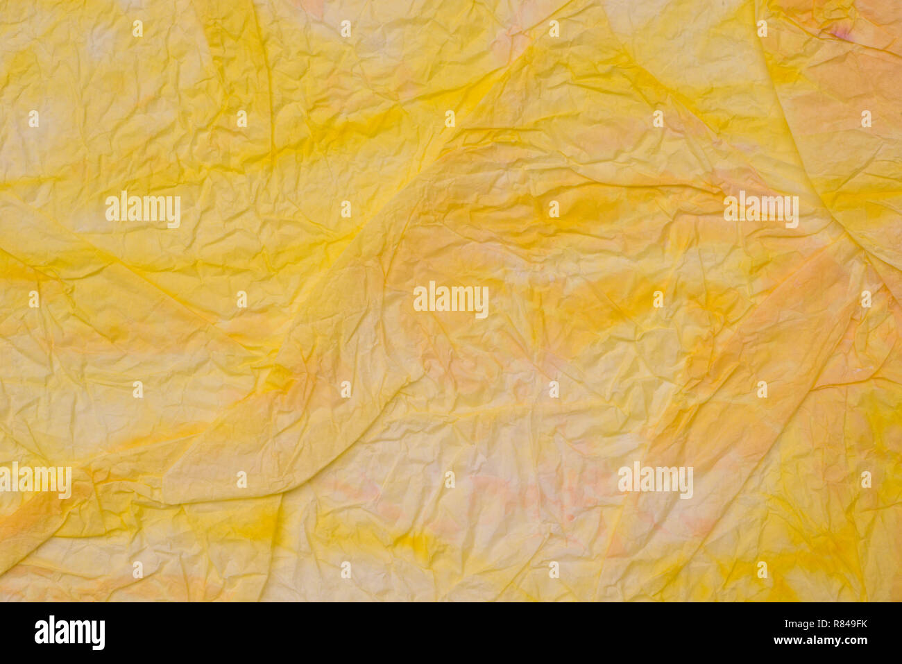 yellow color creased paper tissue texture background Stock Photo - Alamy