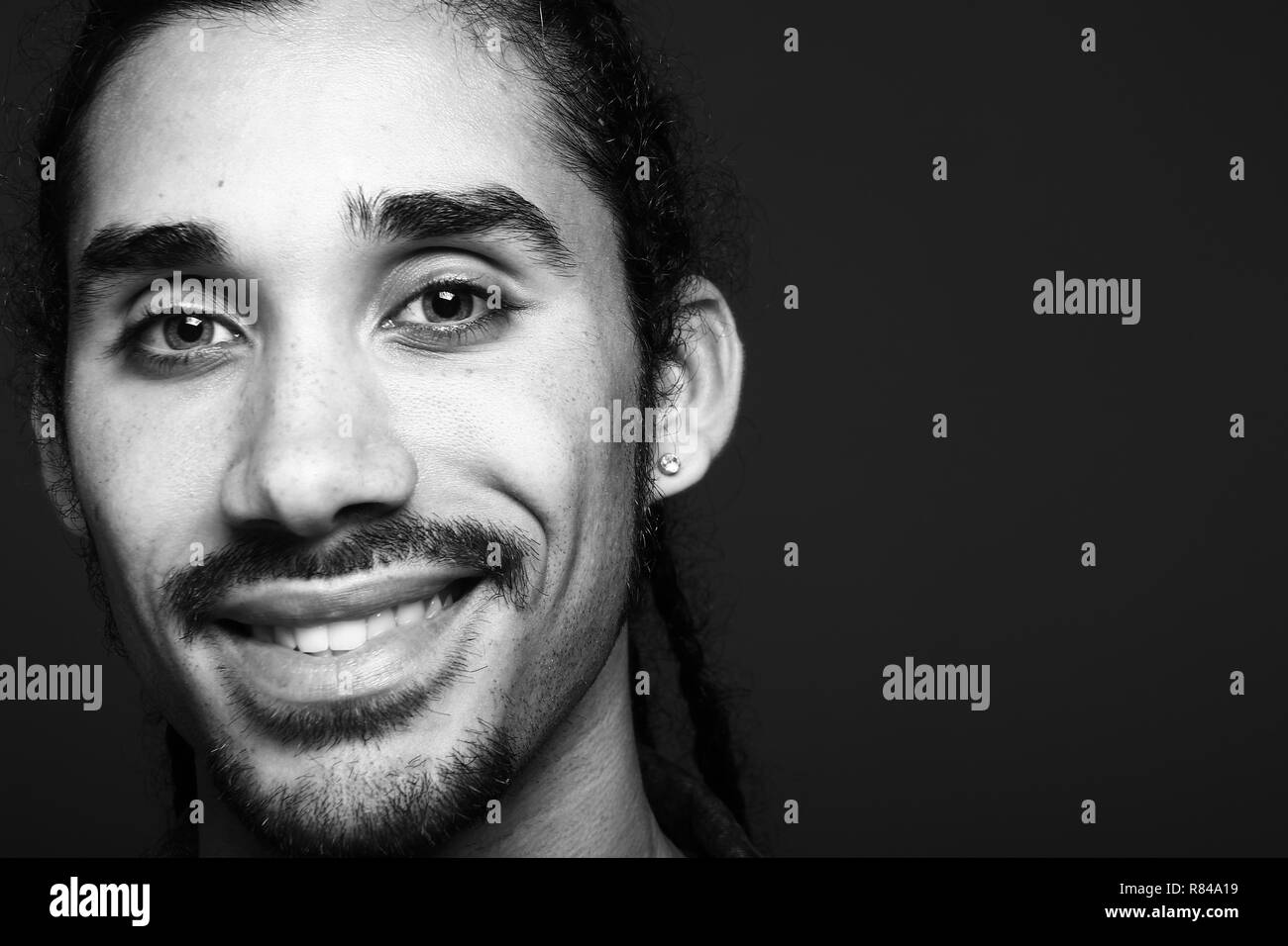 Beautiful man in front of a background Stock Photo - Alamy