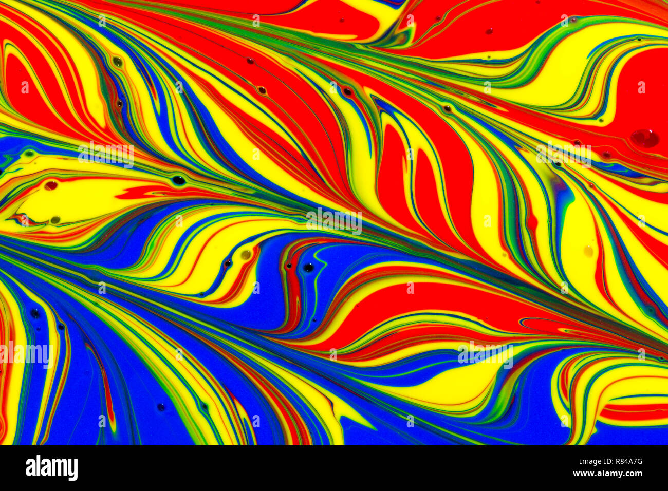 Mixing yellow blue paint to make green hi-res stock photography and ...