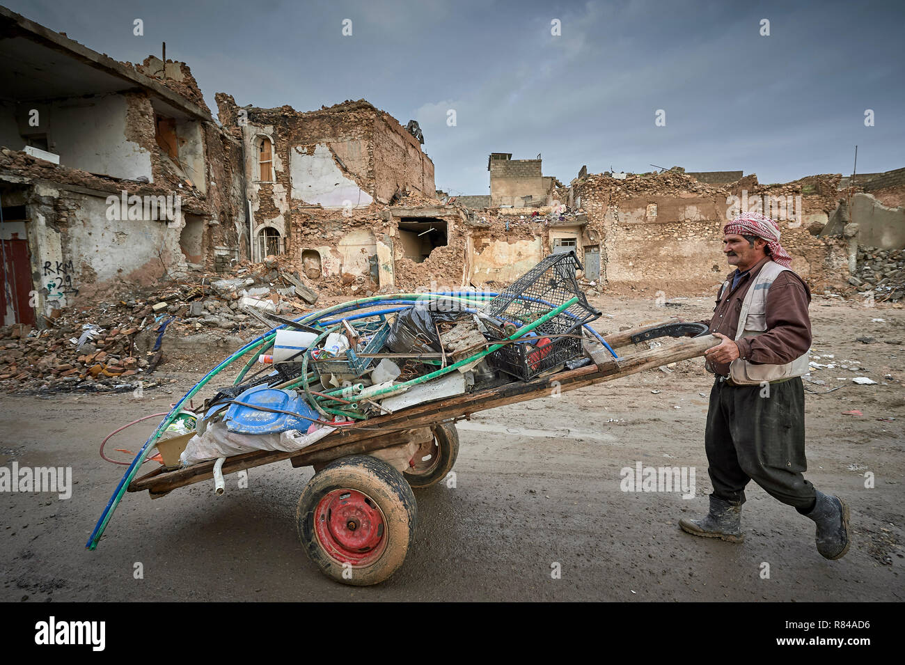 Ahmad Khalil scavenges recyclable metal and plastic from rubble in the ...