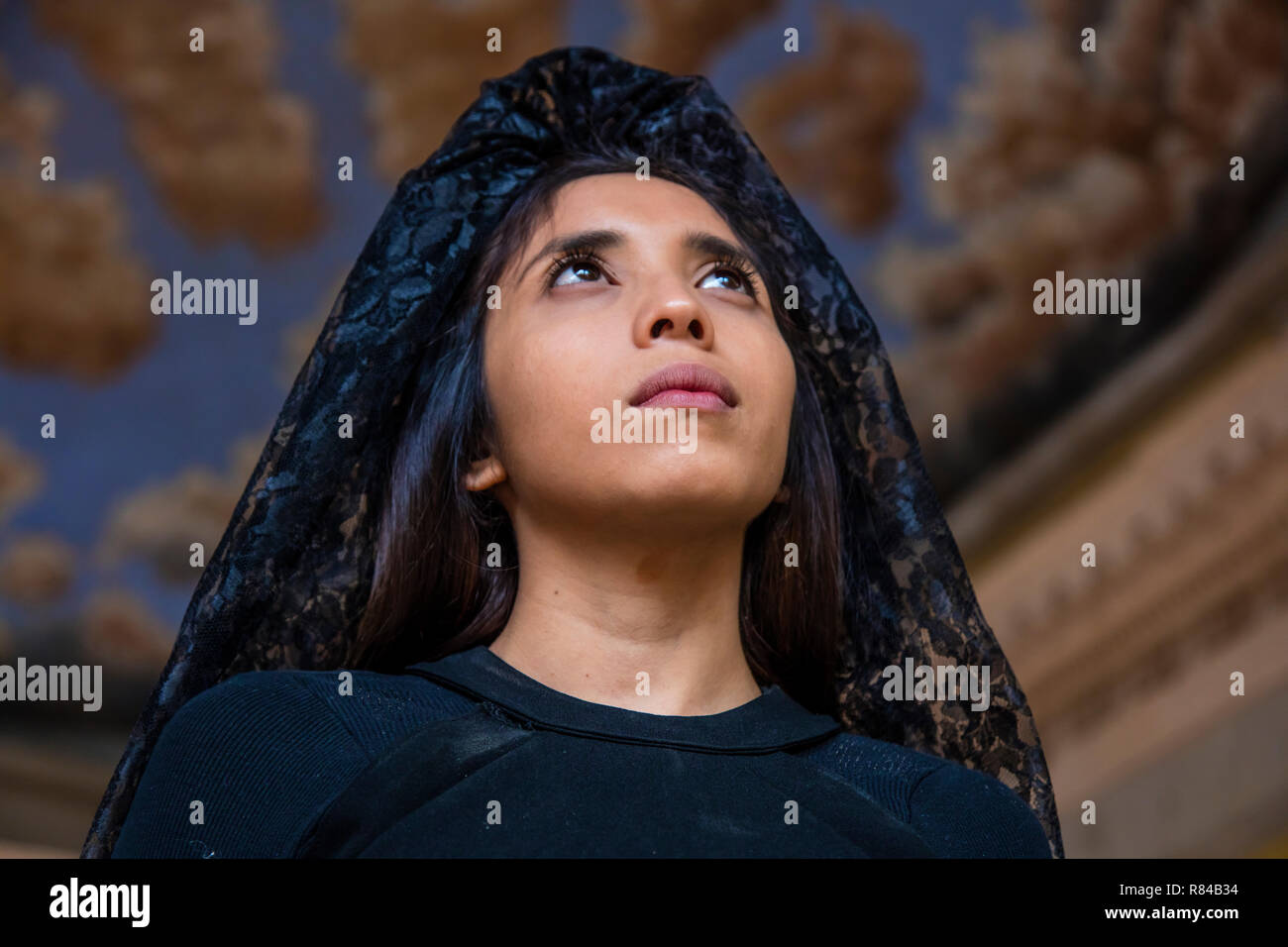 A 20 year old MEXICAN WOMAN dressed in a traditional MANTILLA worn ...