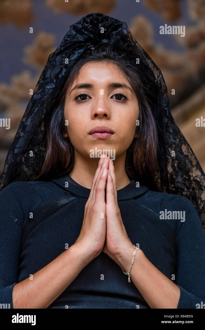 A 20 year old MEXICAN WOMAN dressed in a traditional MANTILLA worn ...