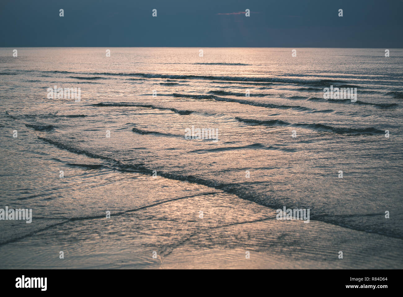 calm blue sunset over clear water in baltic sea. minimalistic image ...