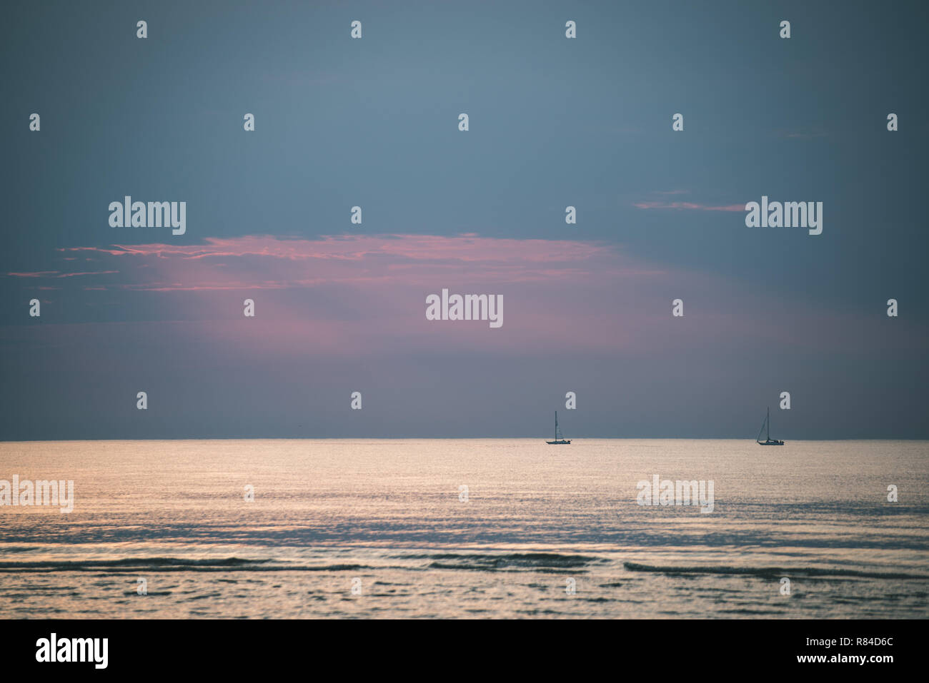 calm blue sunset over clear water in baltic sea. minimalistic image ...