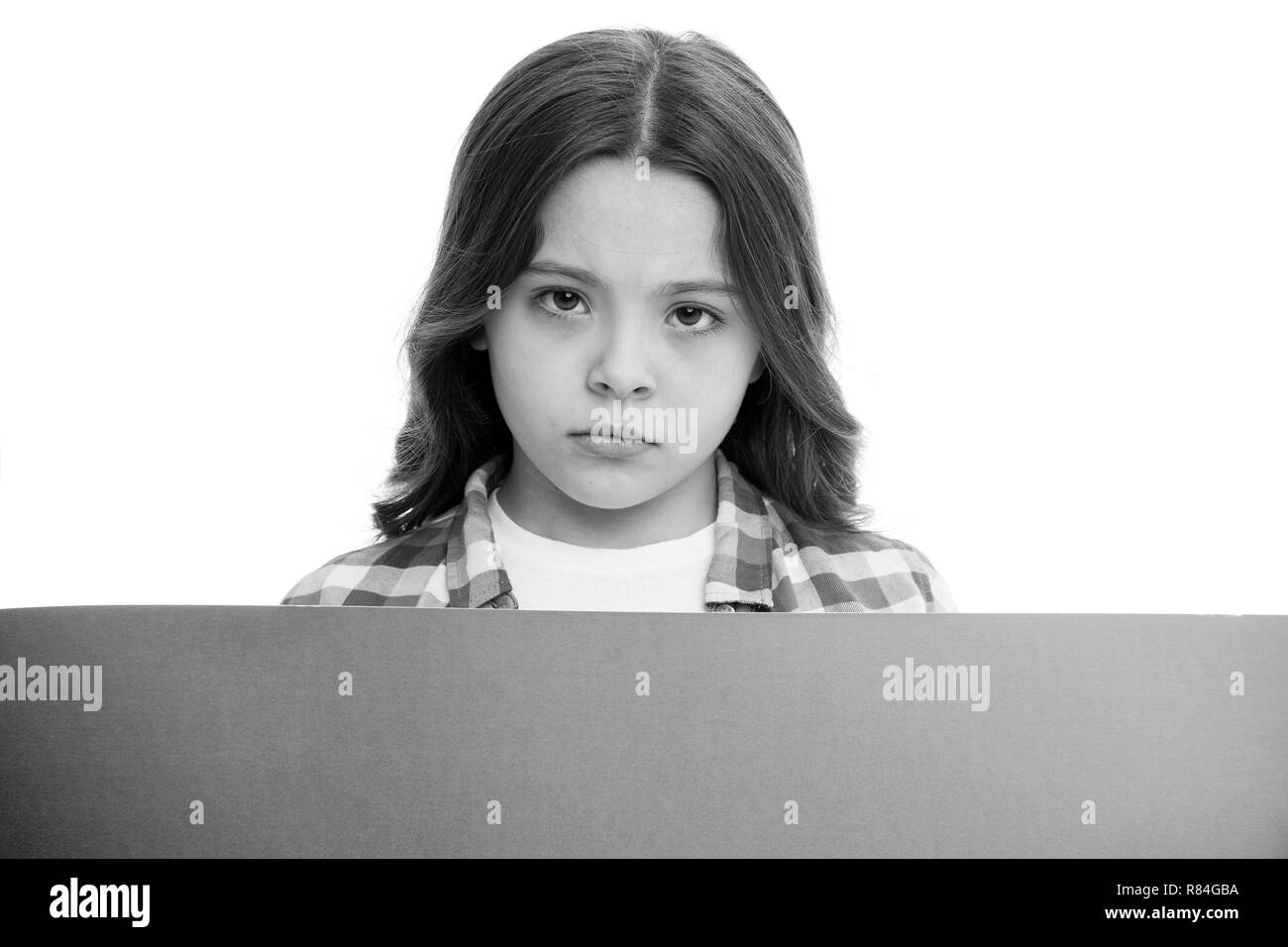 Do not offend children. Girl kid behind pink blank surface copy space ...