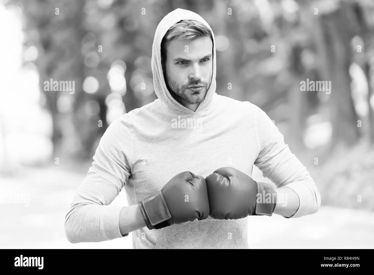 I am ready to fight. Man athlete on concentrated face with sport gloves ...