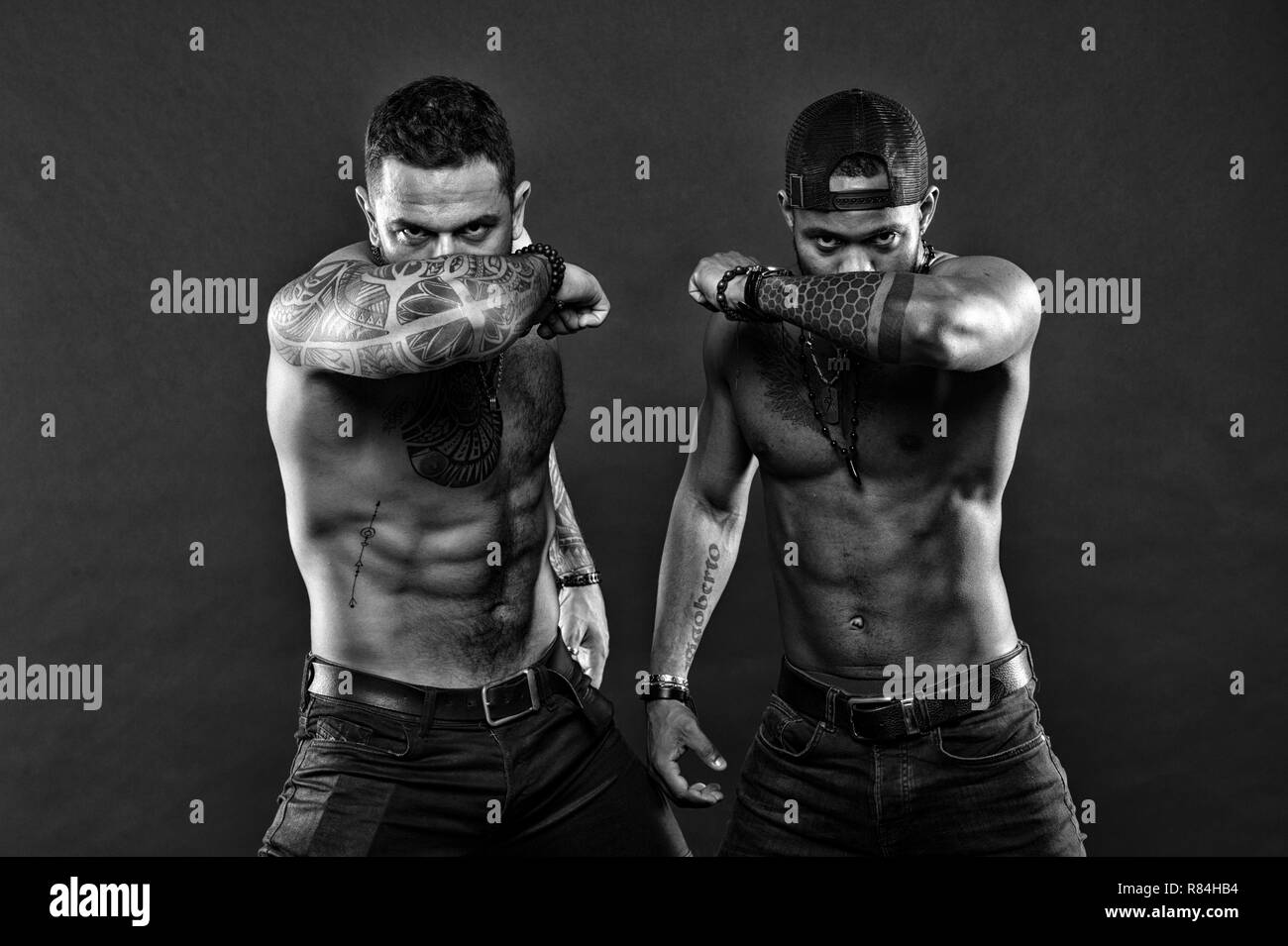 Bearded men show tattooed torso. Brutal strict macho with tattoos ...