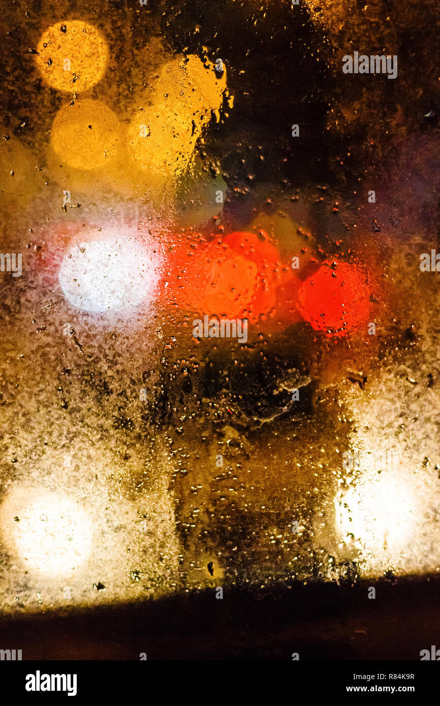 Rain drops on window with bokeh Stock Photo - Alamy