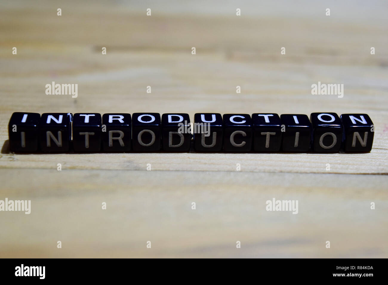 Introduction message written on wooden blocks. education and motivation ...