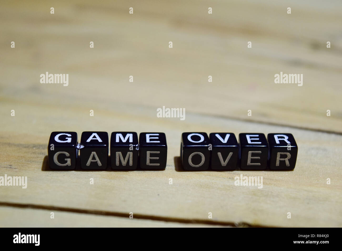 Game over message written on wooden blocks. education and motivation ...