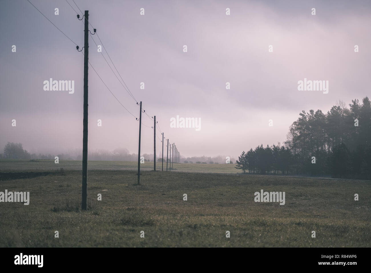 power line electricity poles in country with wires - vintage old film ...