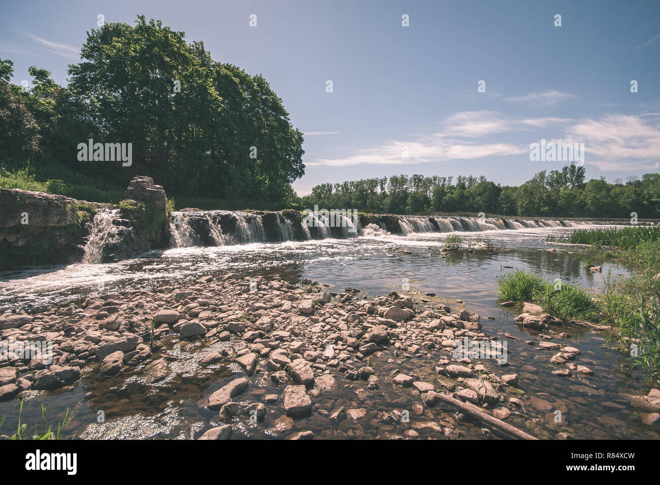 fresh clean waterfall in summer with loads of water - vintage retro ...