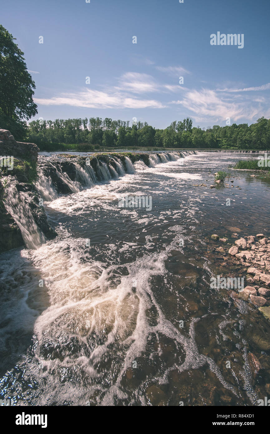 fresh clean waterfall in summer with loads of water - vintage retro ...