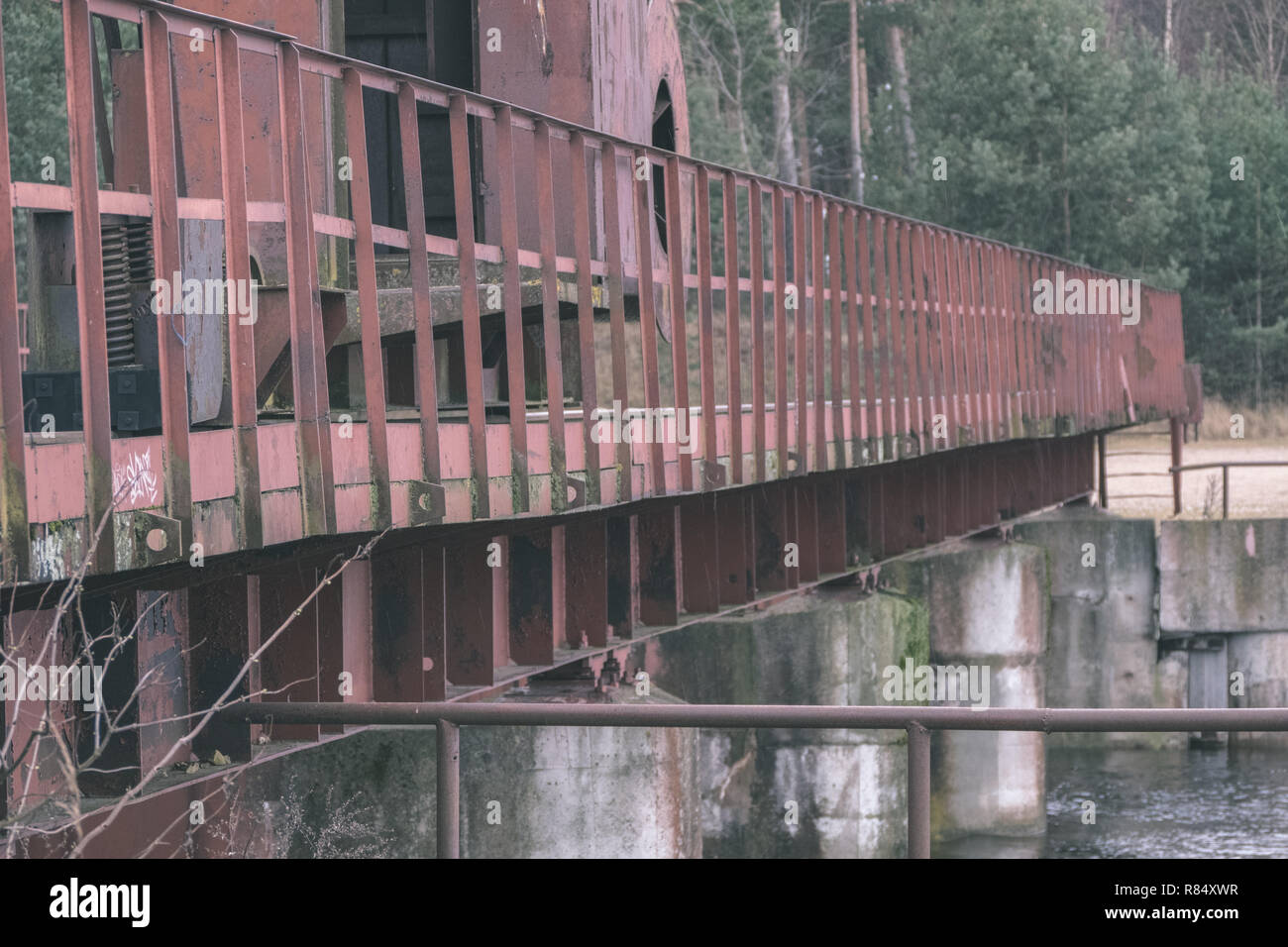 old red metal bridge over water. rusty details and close ups - vintage ...
