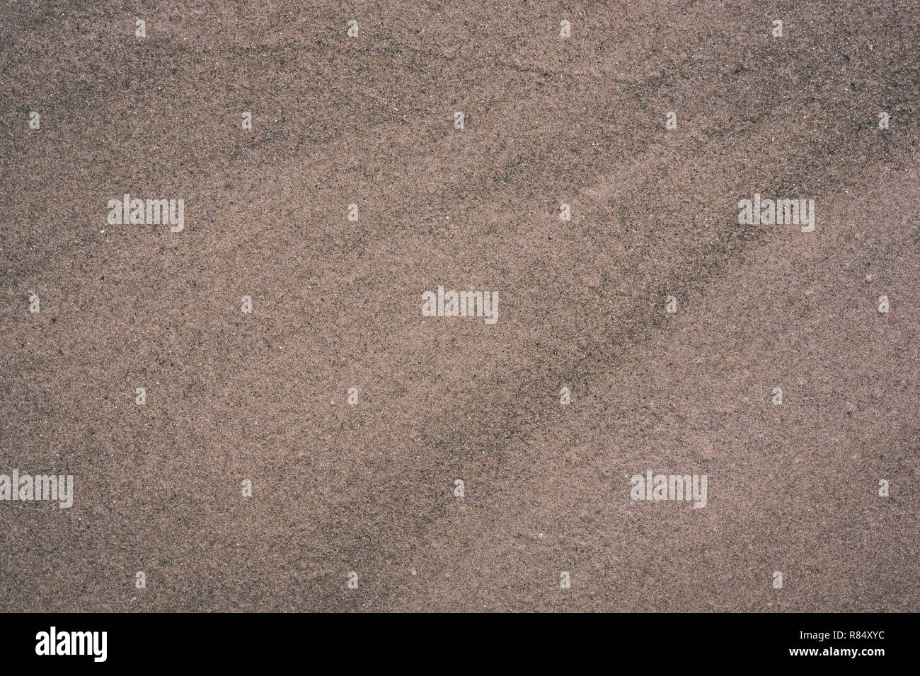 abstract texture sand pattern near water body with some plants ...