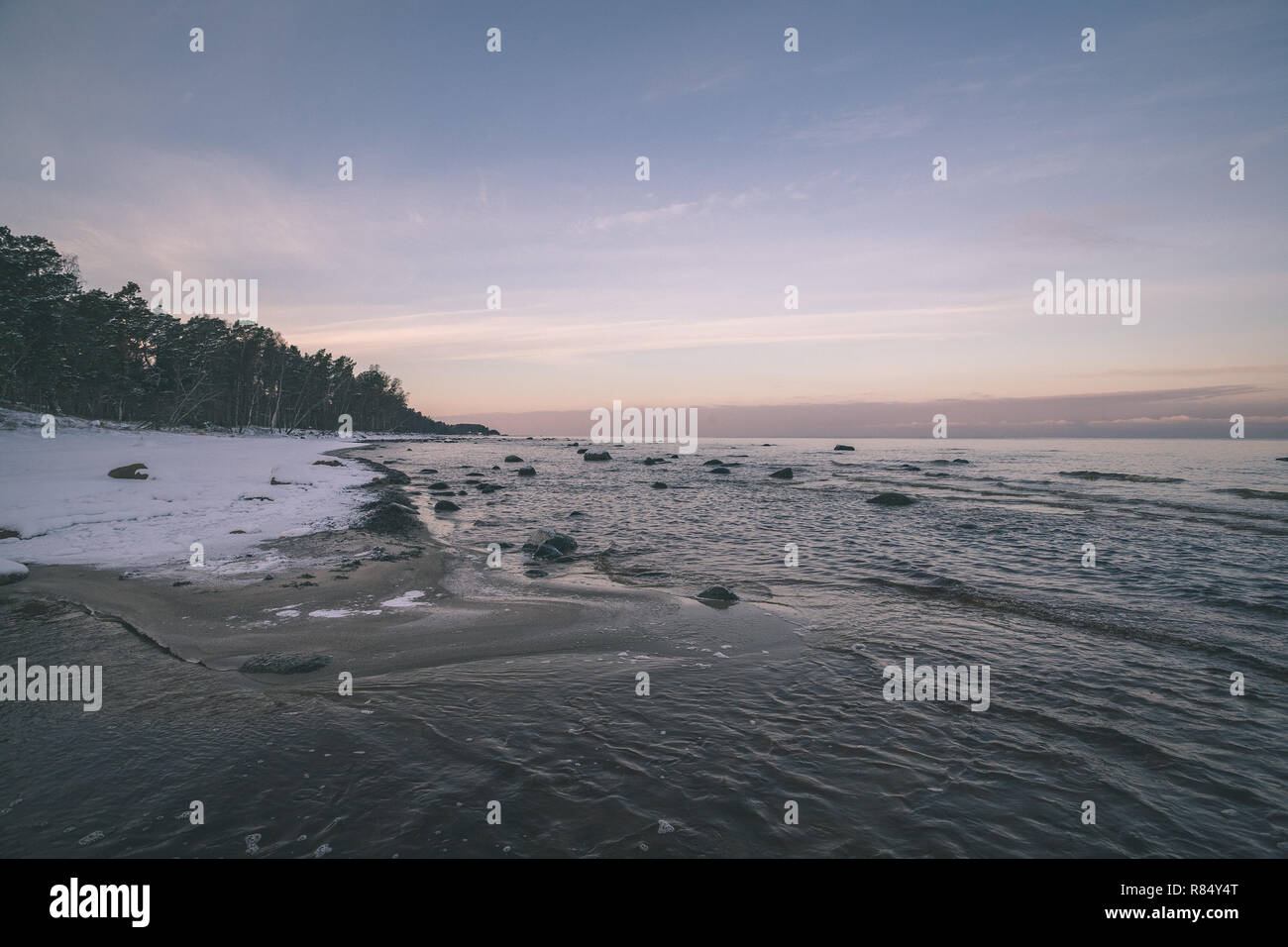 frozen sea side beach panorama in winter with lots of ice and snow in ...