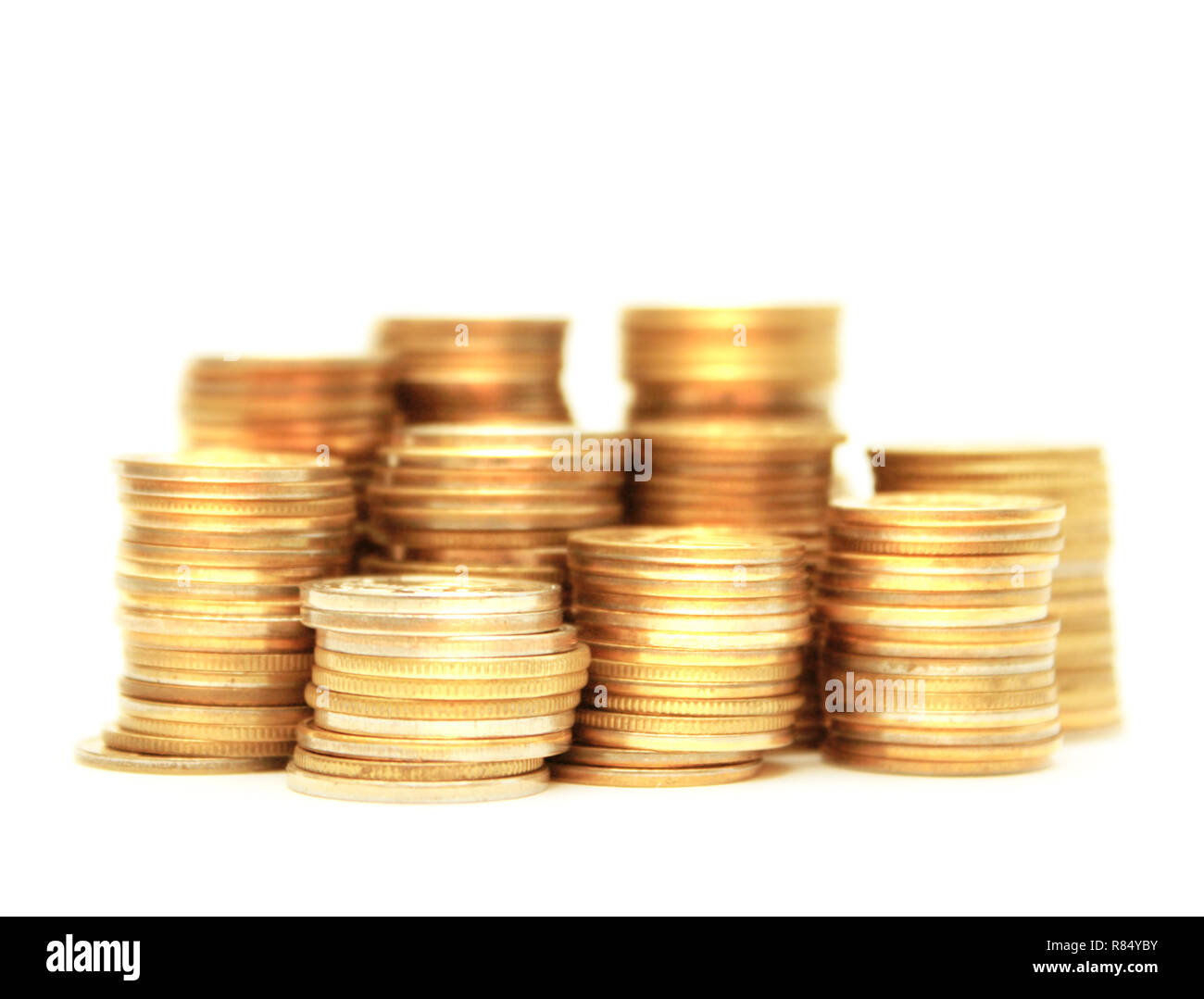 Many gold coins. Isolated on white background Stock Photo - Alamy