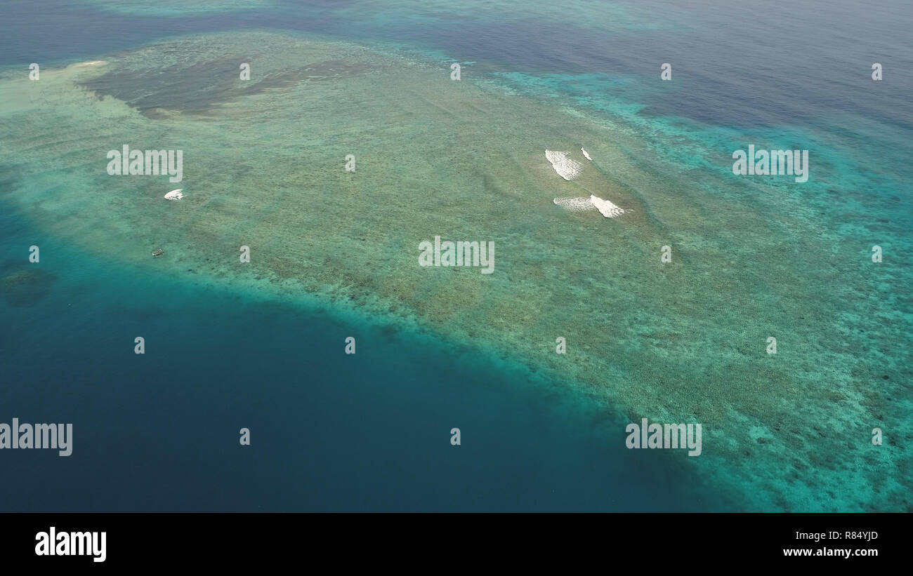 seascape aerial view coral reef, atoll with turquoise water in sea ...