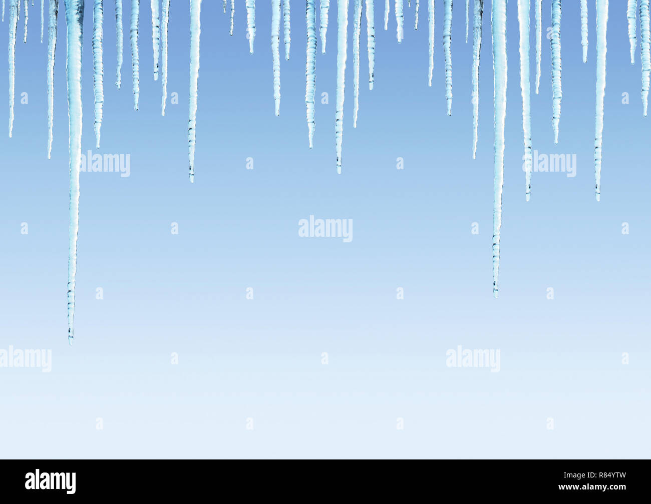 Seamless border with icicles on blue sky Stock Photo - Alamy