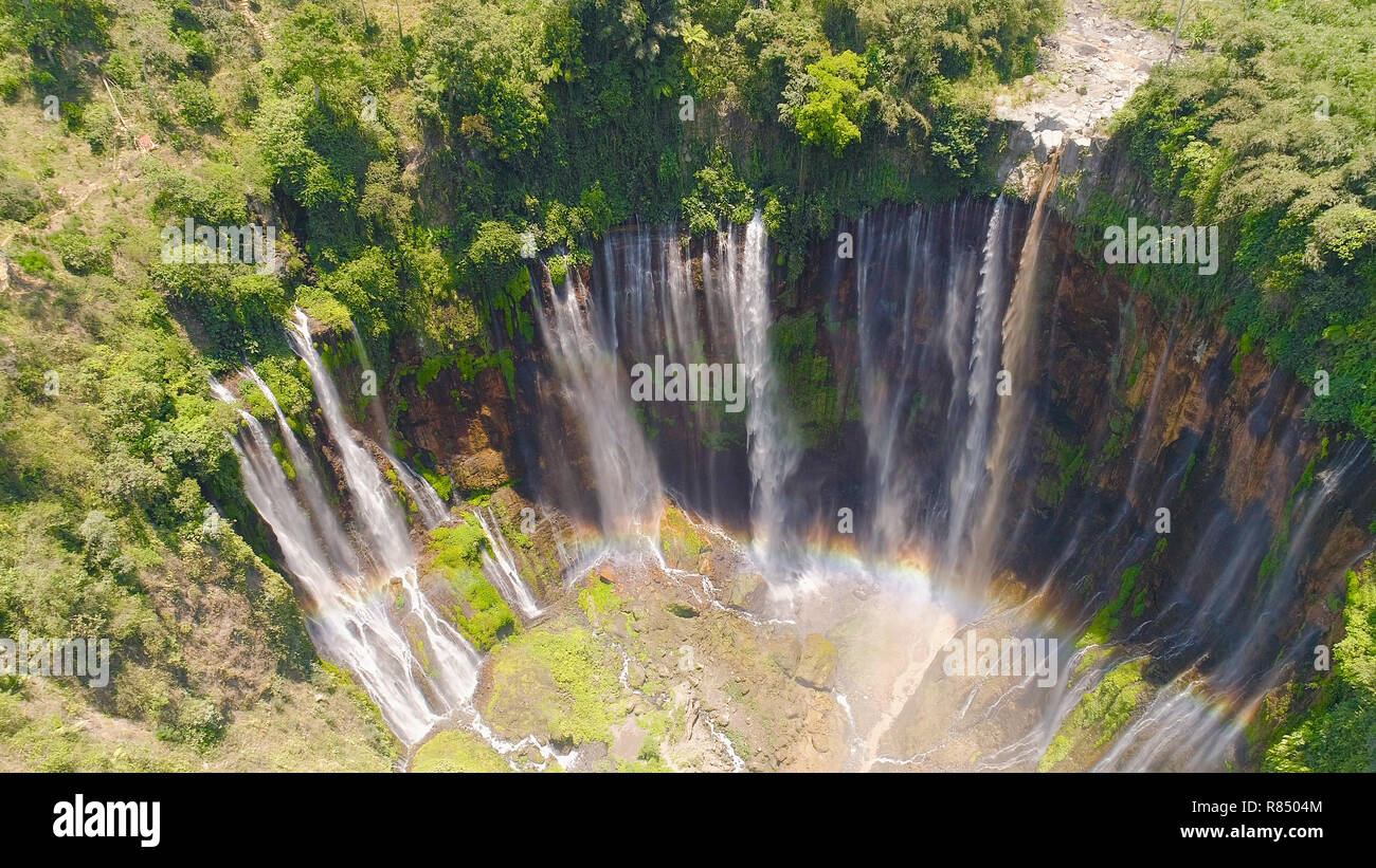 beautiful waterfall Coban Sewu in tropical forest, Java Indonesia ...