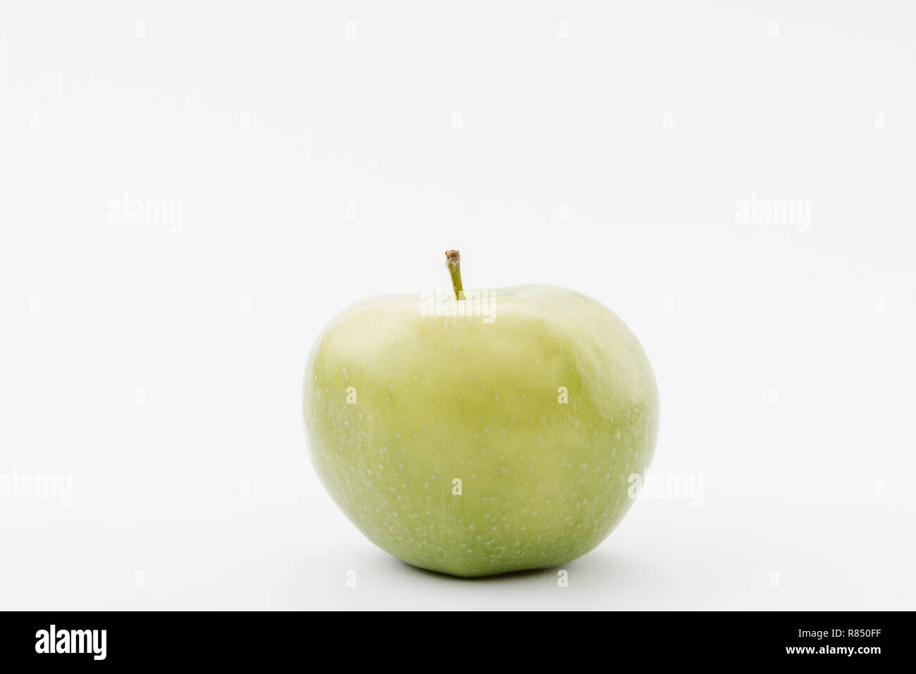 large ripe green apple on white background Stock Photo - Alamy