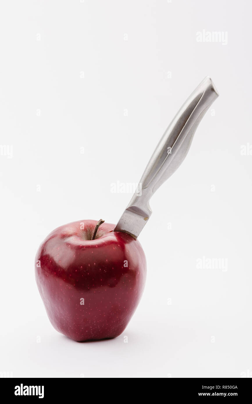 carving knife in whole red delicious apple isolated on white Stock ...
