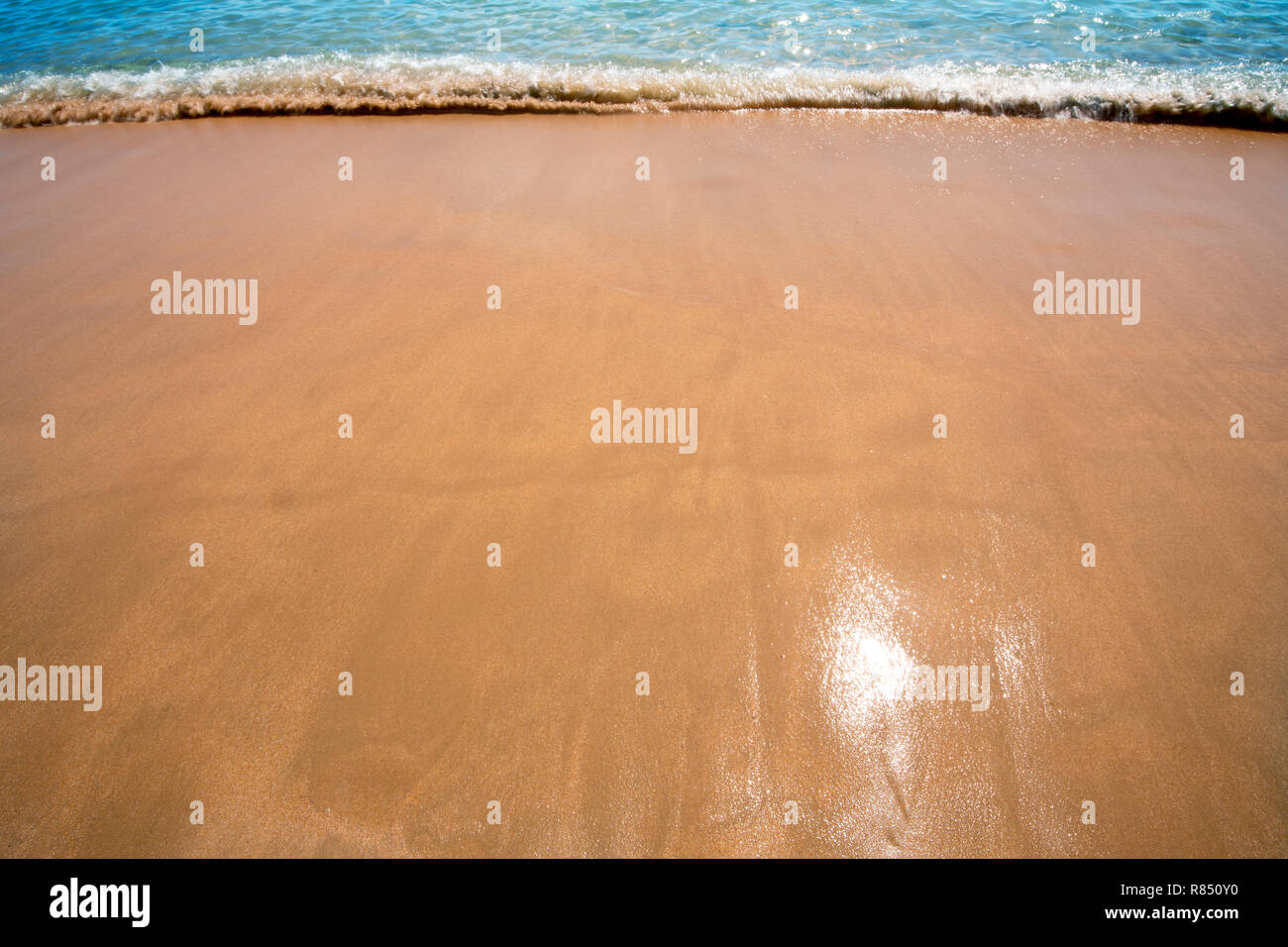 Sand beach with waves blue,background nature ocean Stock Photo - Alamy