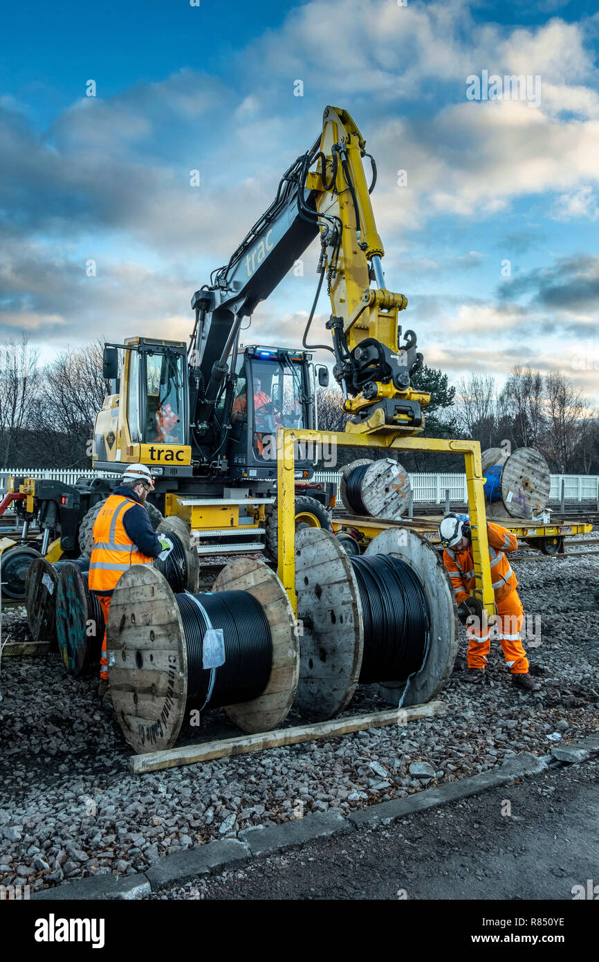 Rail workers laying new track, balls, installing points and laying ...