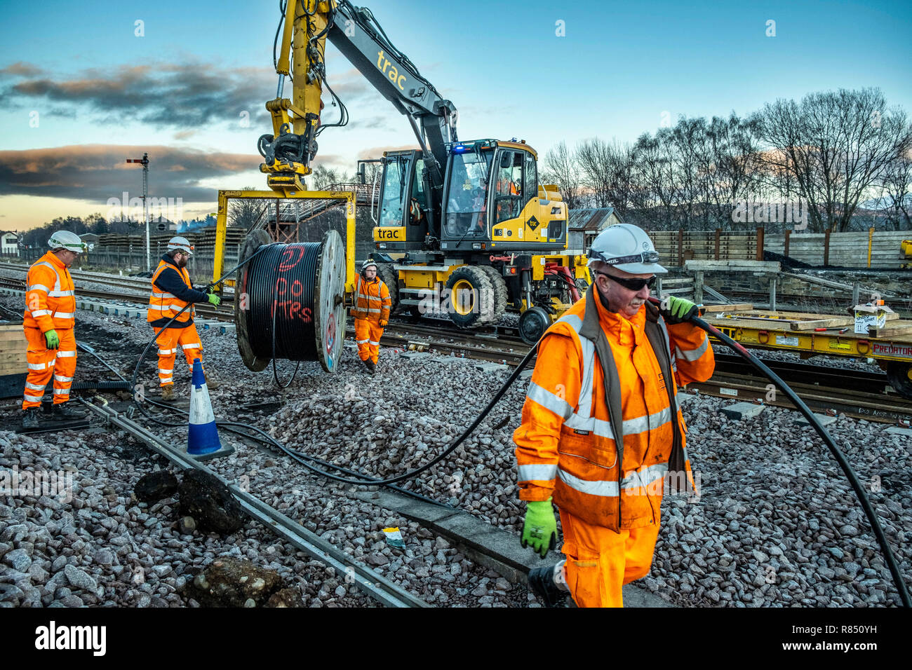Rail workers laying new track, balls, installing points and laying ...