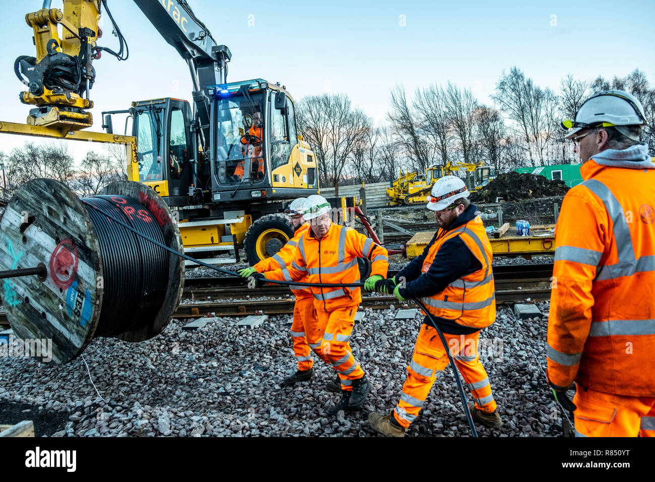 Rail workers laying new track, balls, installing points and laying ...
