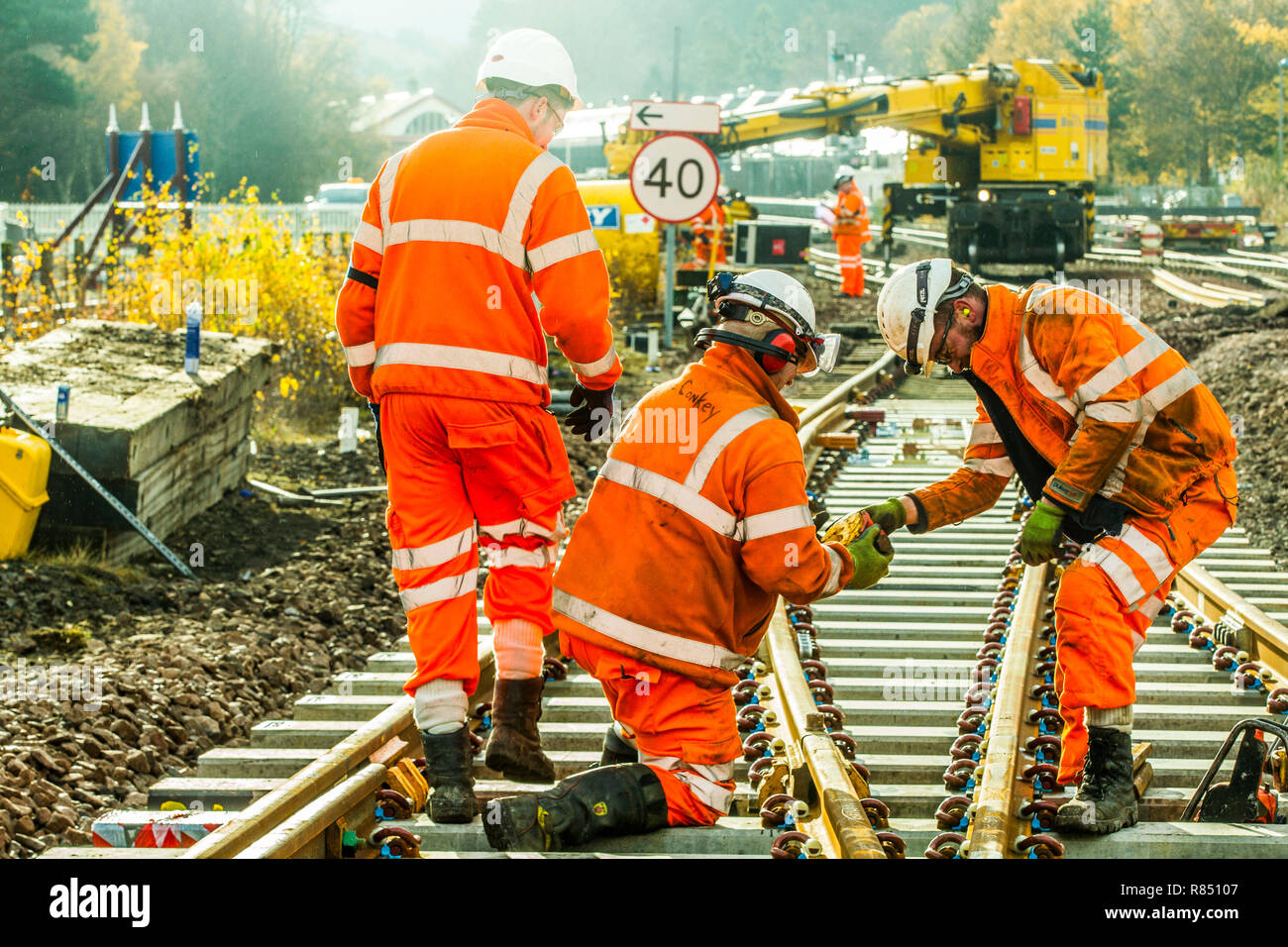 Rail workers laying new track, balls, installing points and laying ...