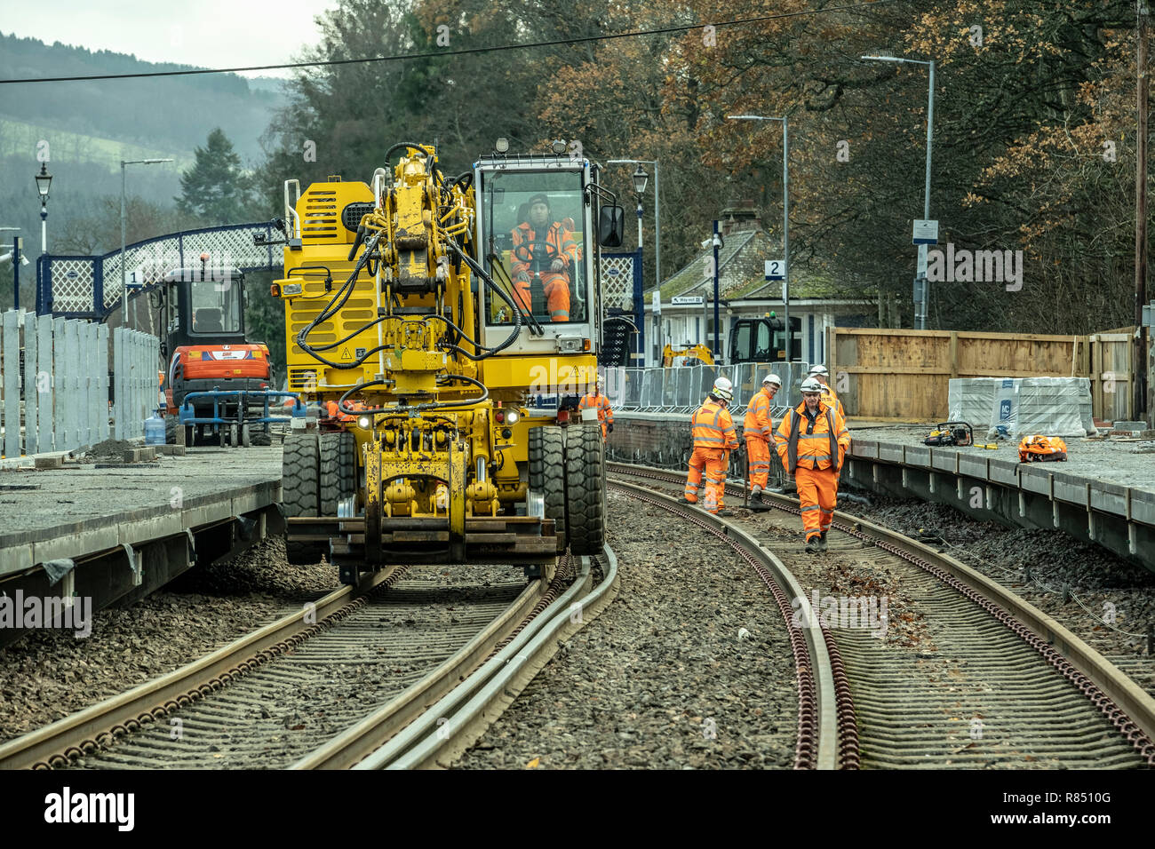 Rail workers laying new track, balls, installing points and laying ...
