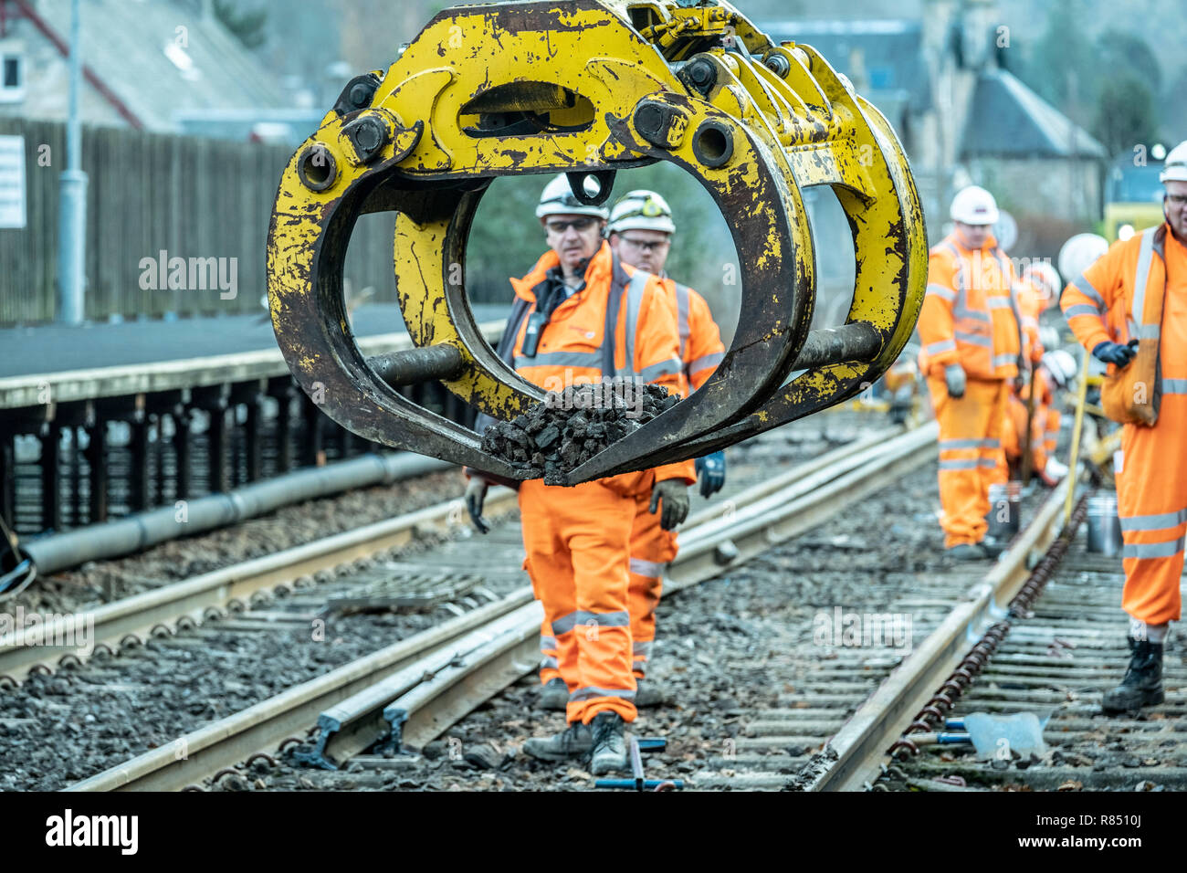 Rail workers laying new track, balls, installing points and laying ...