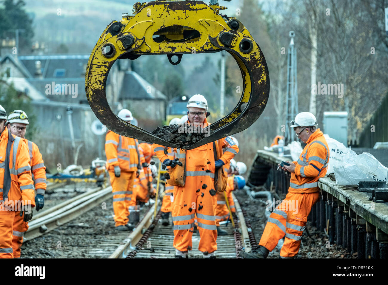 Rail workers laying new track, balls, installing points and laying ...
