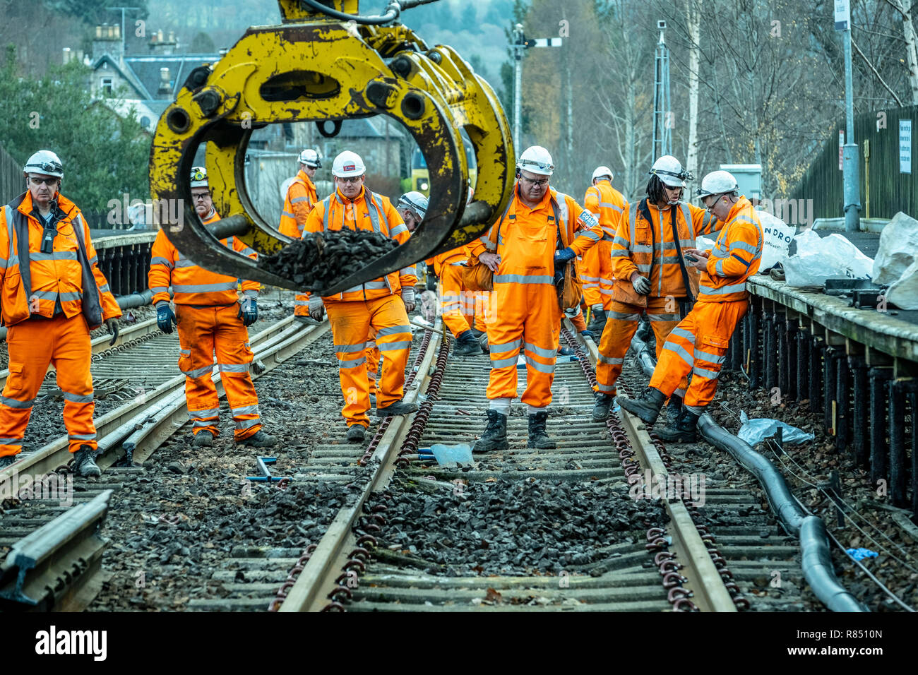 Rail workers laying new track, balls, installing points and laying ...