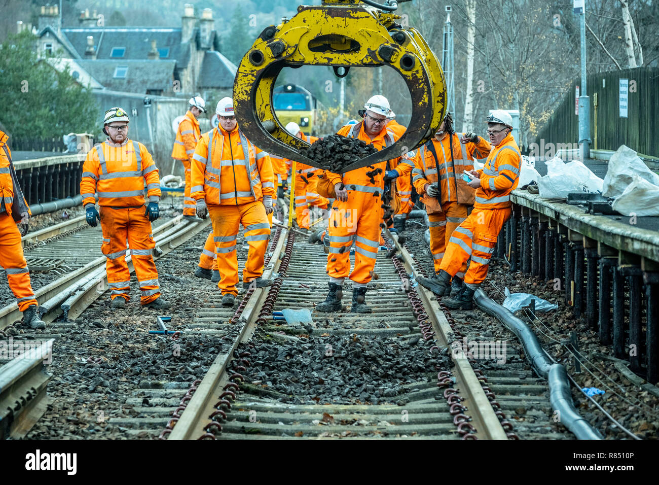 Rail workers laying new track, balls, installing points and laying ...