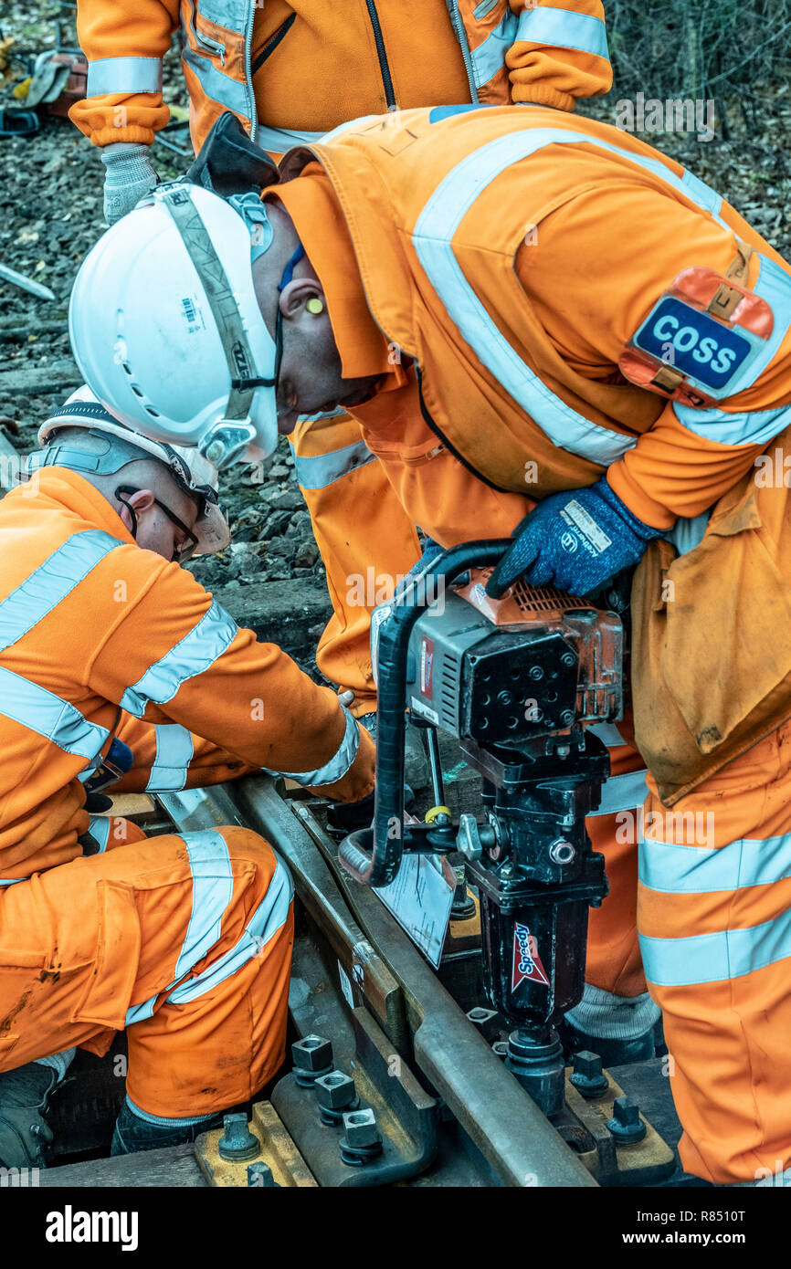 Rail workers laying new track, balls, installing points and laying ...