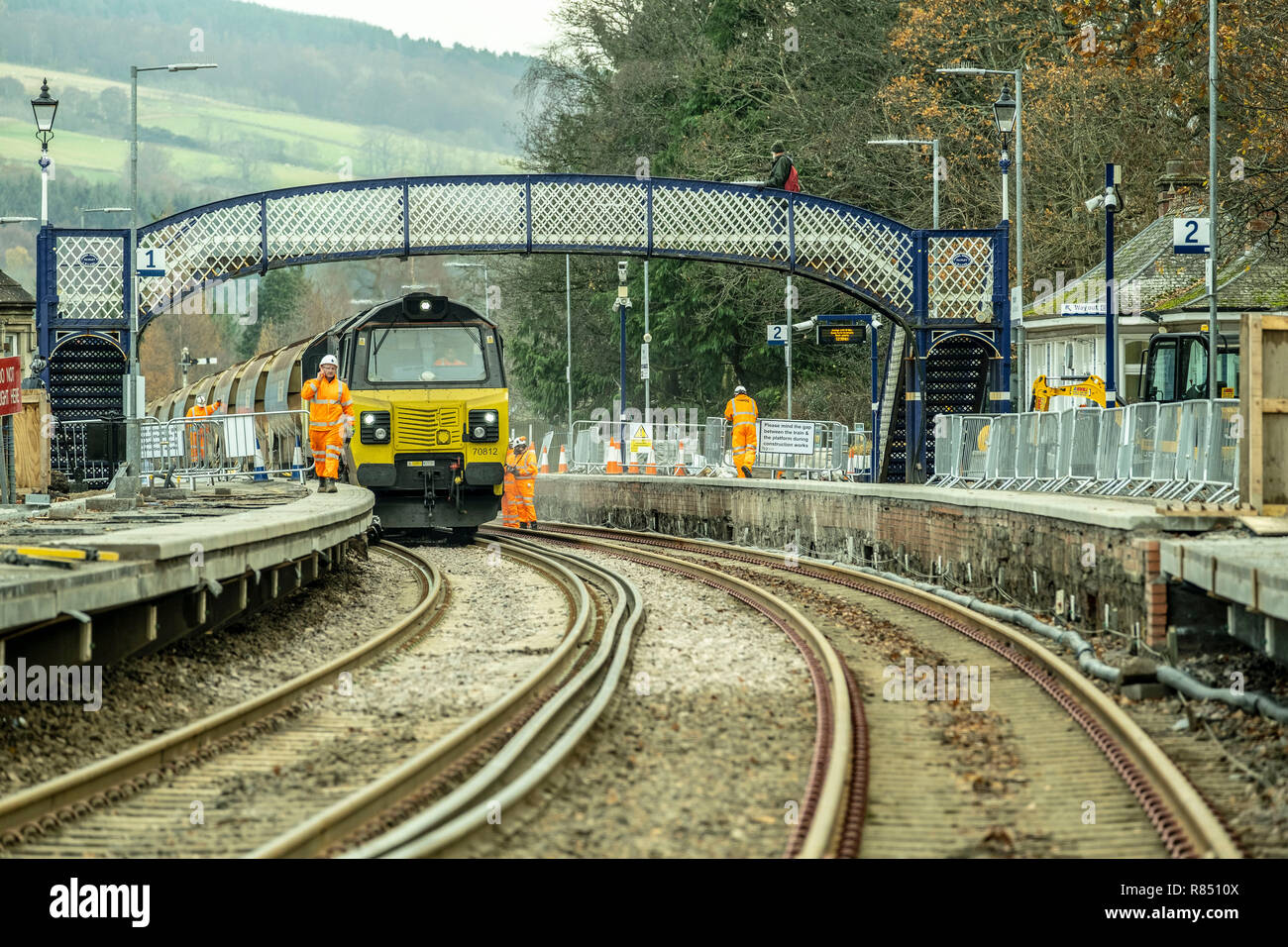 Rail workers laying new track, balls, installing points and laying ...