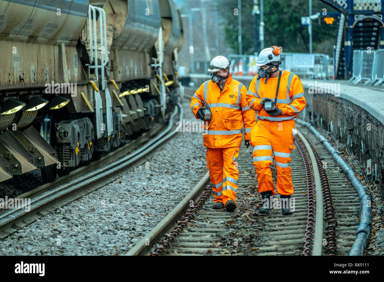 Rail workers laying new track, balls, installing points and laying ...