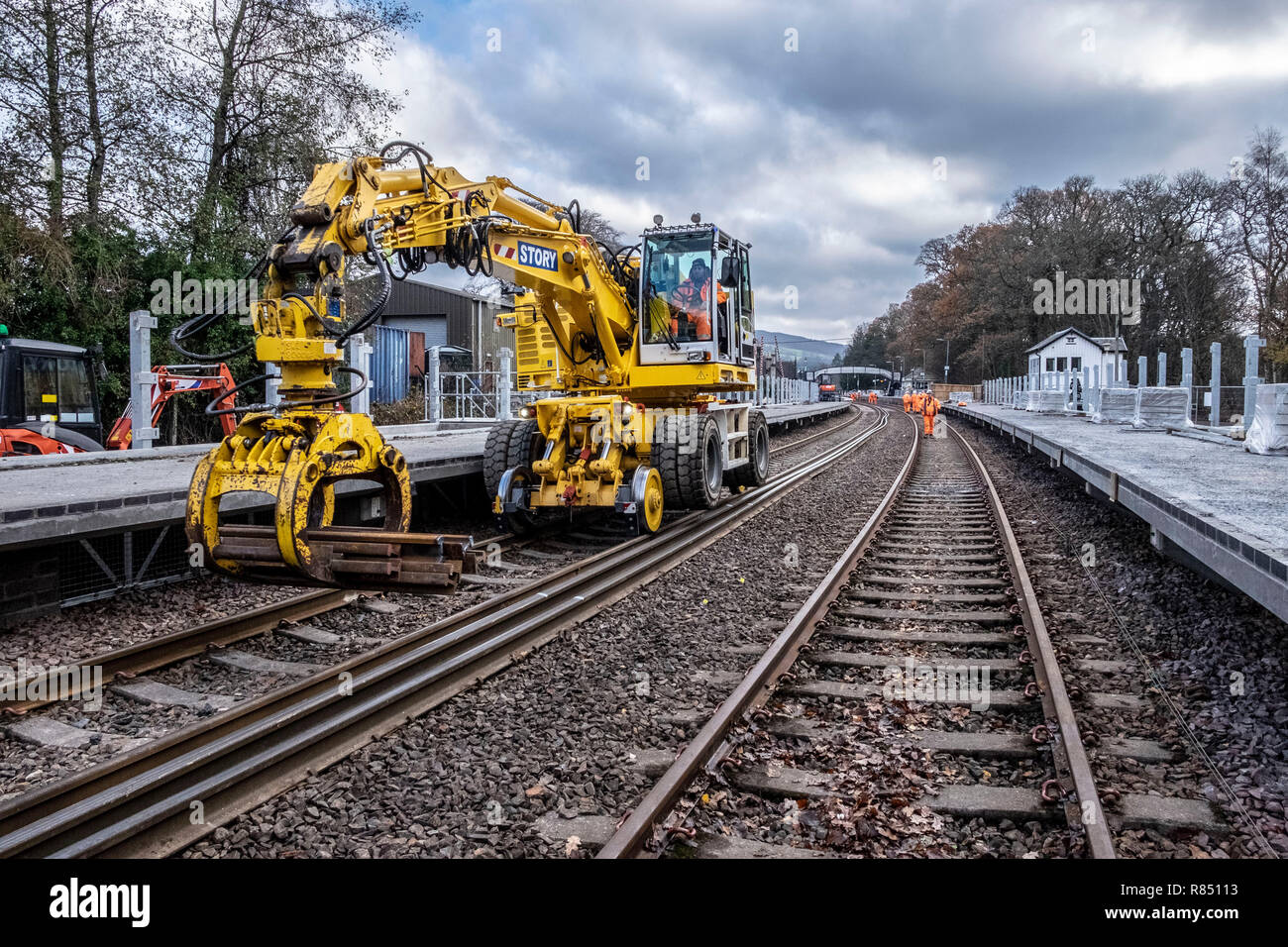 Rail workers laying new track, balls, installing points and laying ...