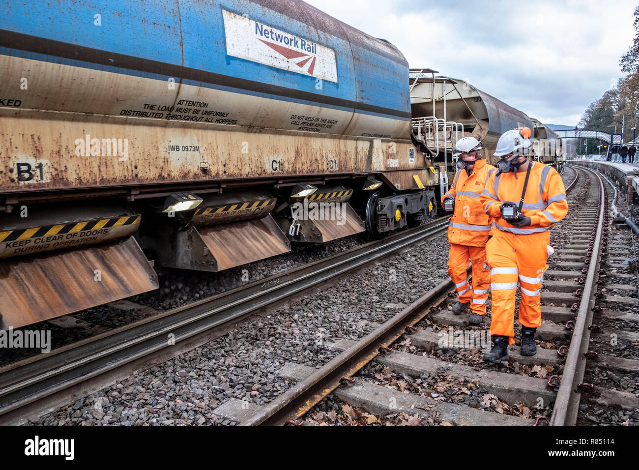 Rail workers laying new track, balls, installing points and laying ...
