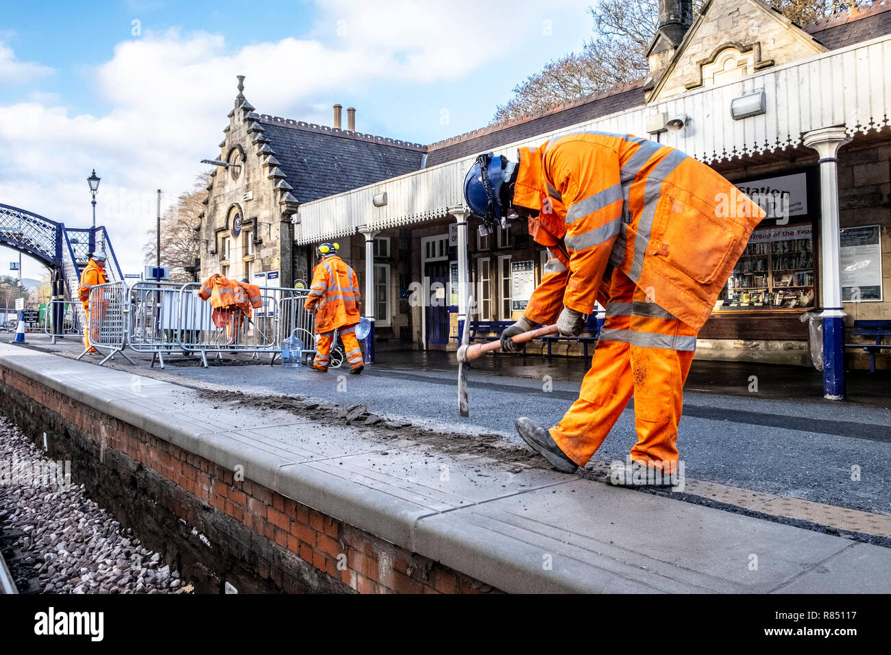 Rail workers laying new track, balls, installing points and laying ...