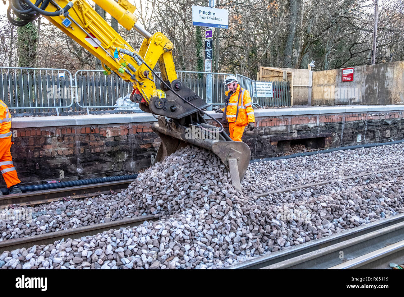 Rail workers laying new track, balls, installing points and laying ...