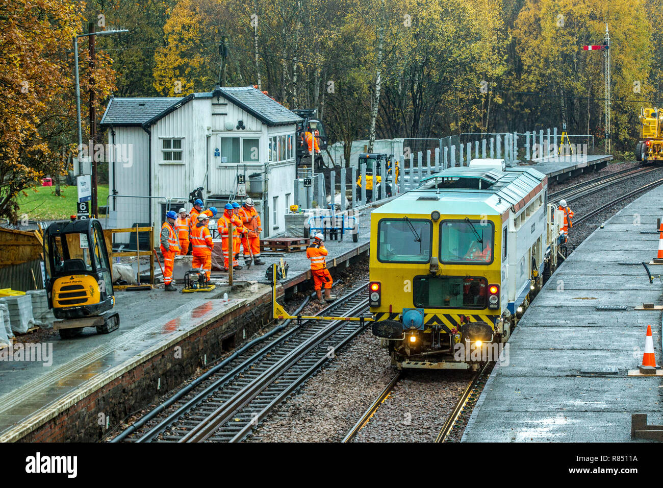 Rail workers laying new track, balls, installing points and laying ...