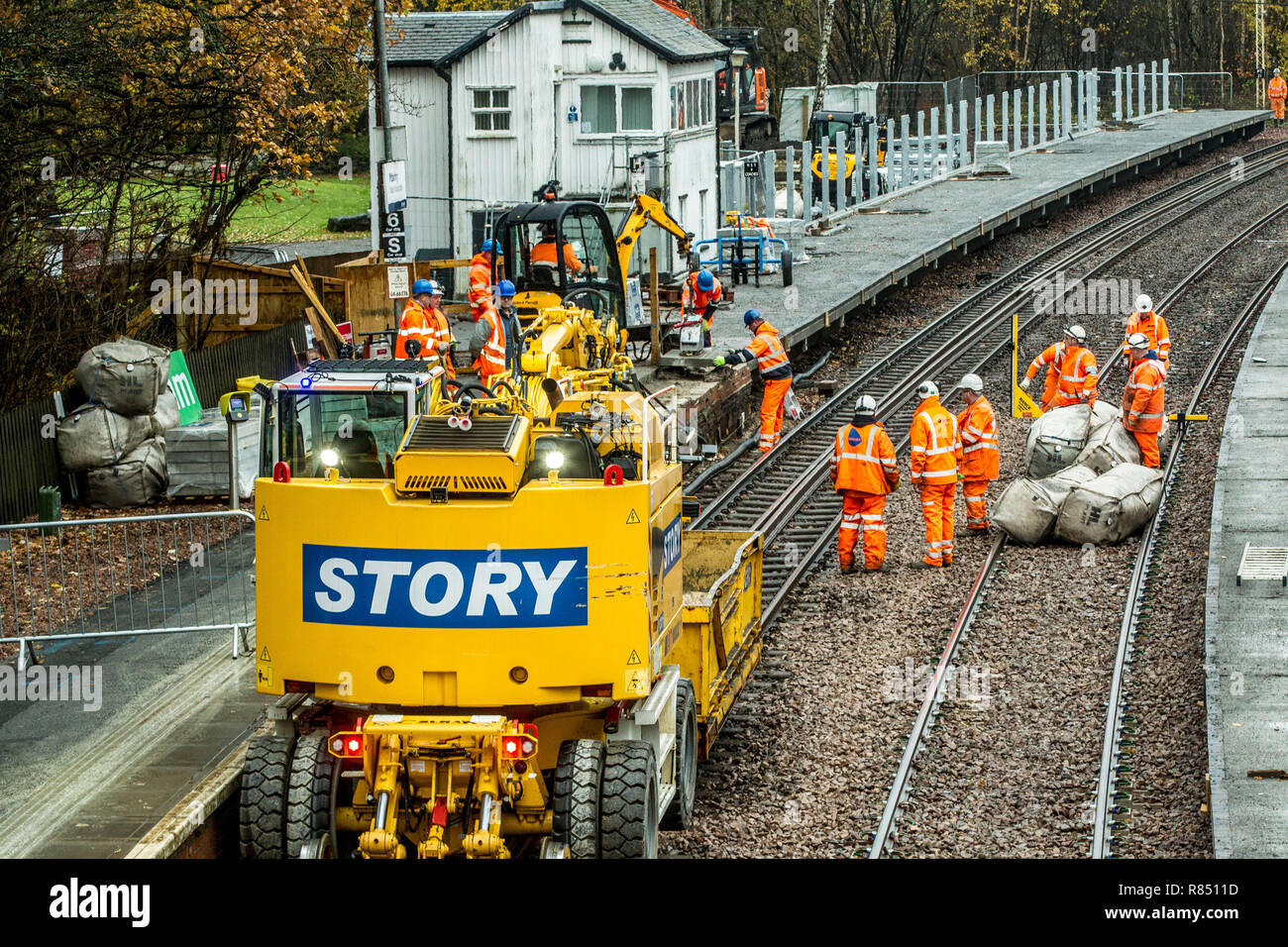 Rail workers laying new track, balls, installing points and laying ...