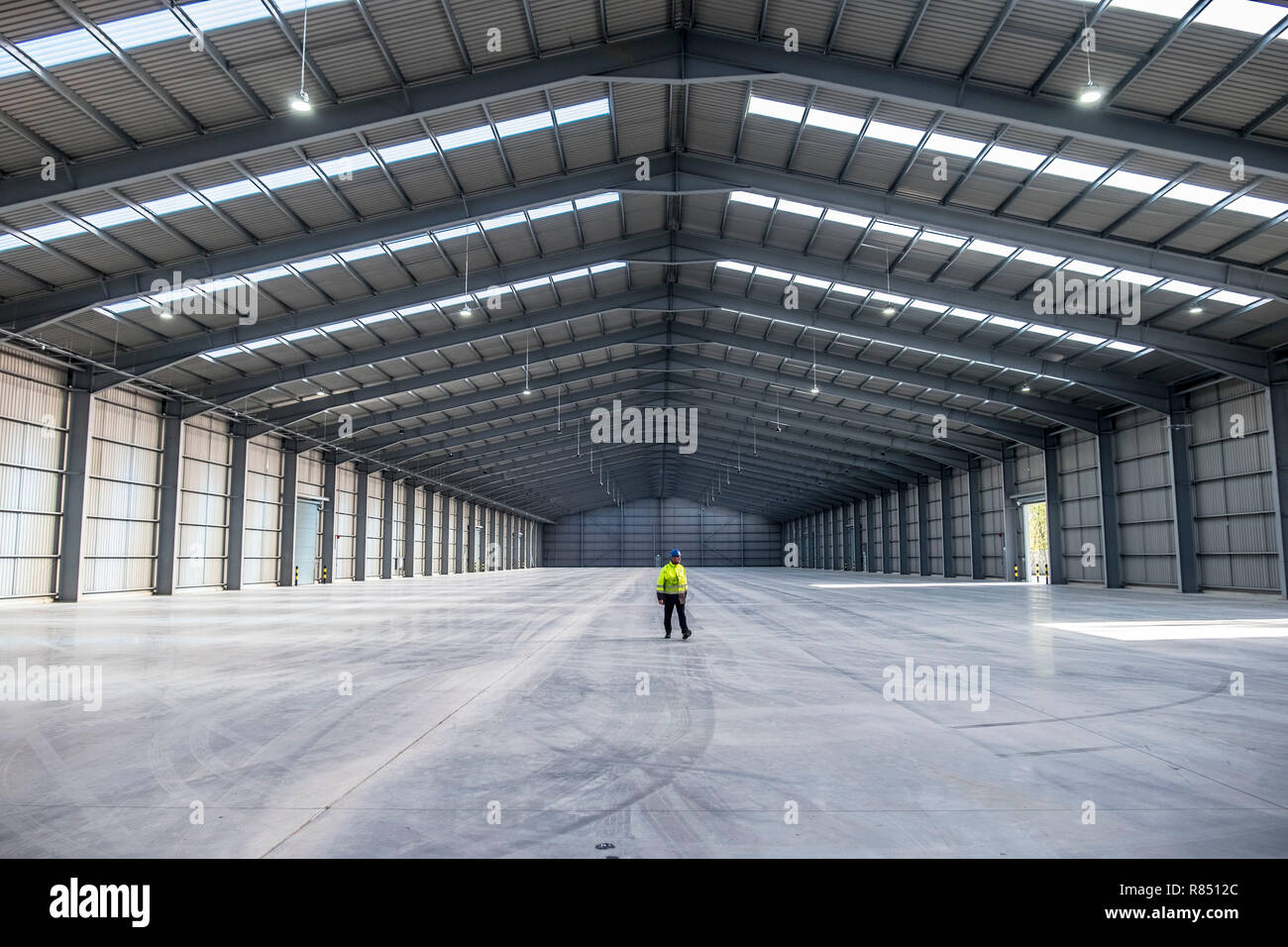 enormous empty warehouse space Stock Photo - Alamy