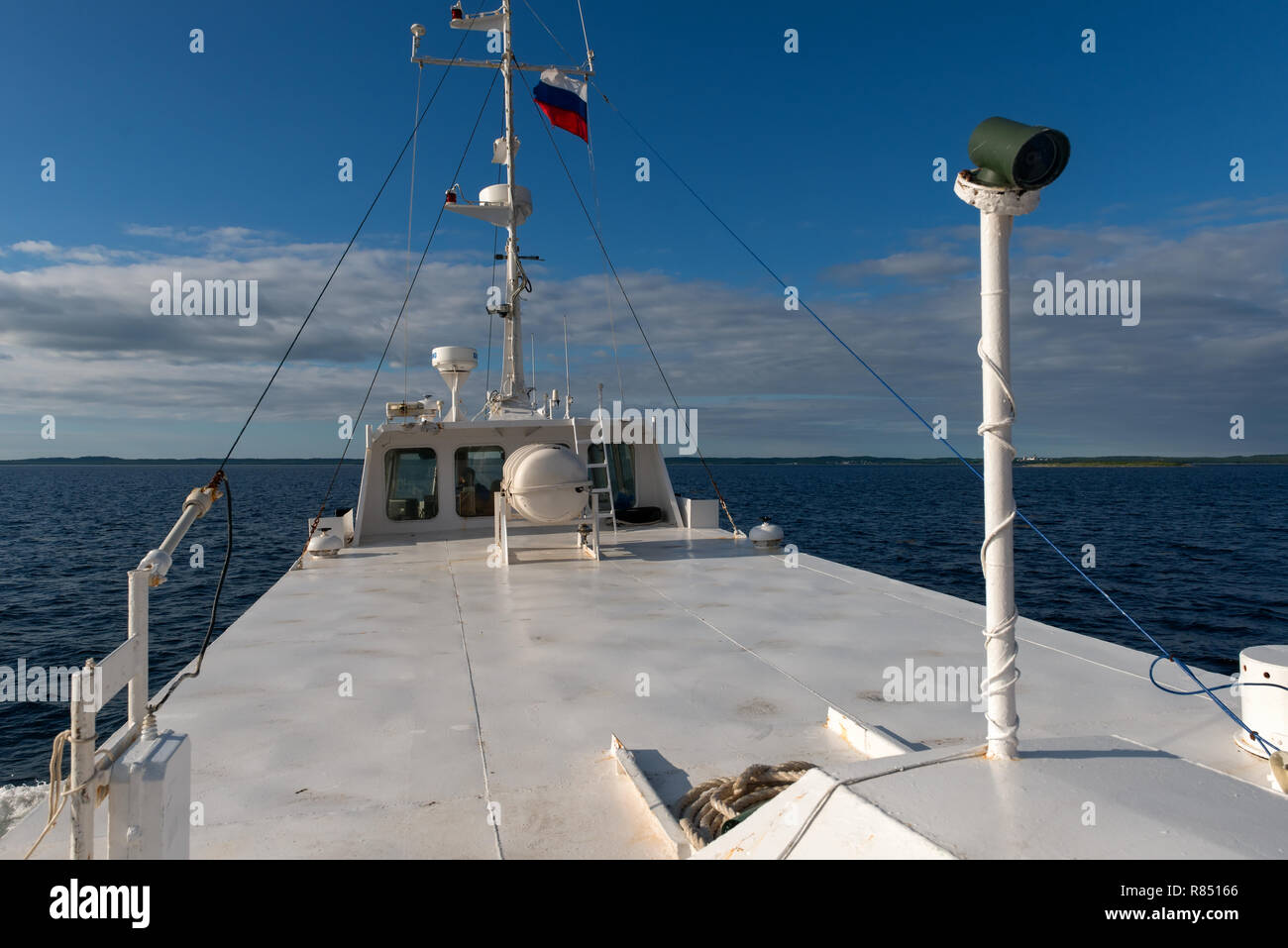 White ship sails on the white sea Stock Photo - Alamy