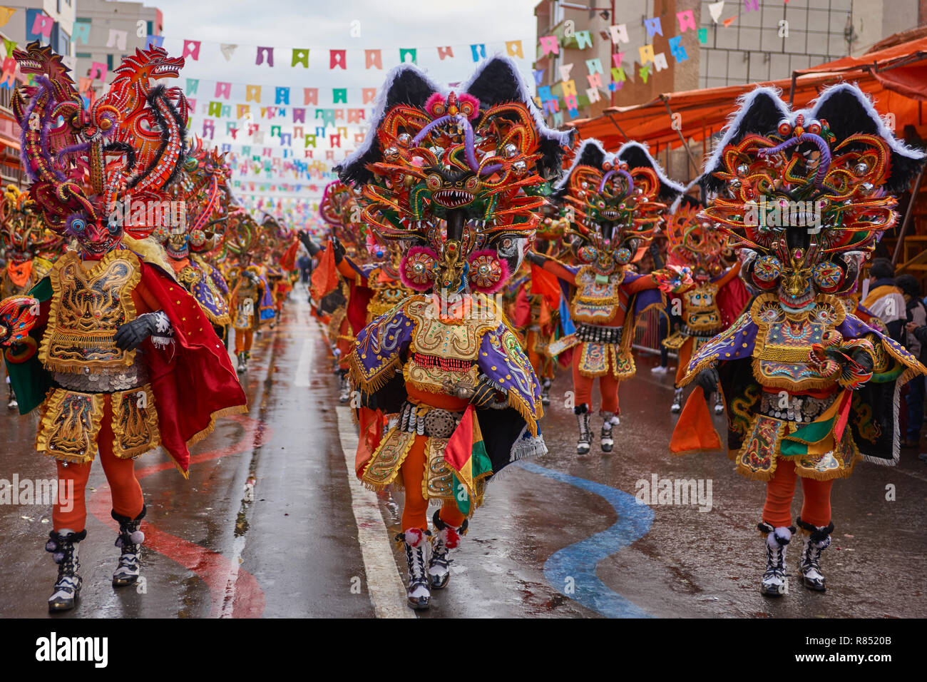Diablada dancers in ornate costumes parade through the mining city of ...
