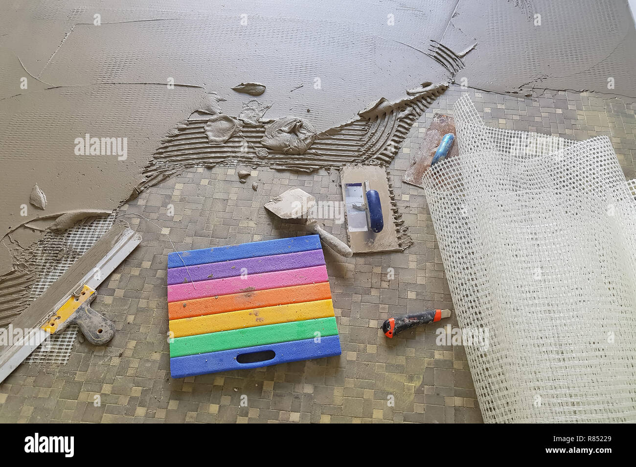 Balcony floor tiles installation. Laying tiles from porcelain. Interior ...